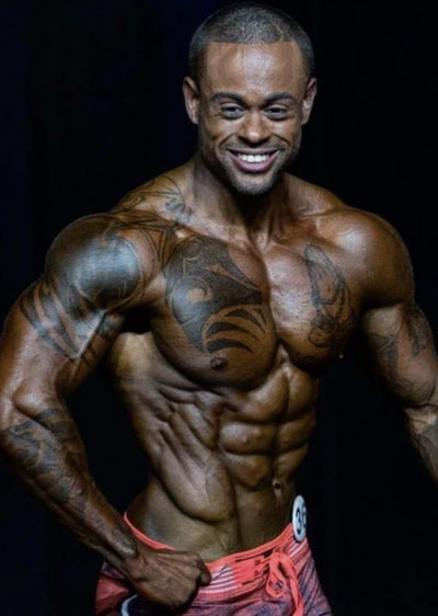 Mon Ethos Pro President David Whitaker signs IFBB Pro Bodybuilder Kai ...