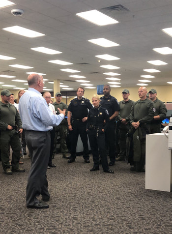 Aurora Police Chief thanks Alarm Detection Systems for donation of ...