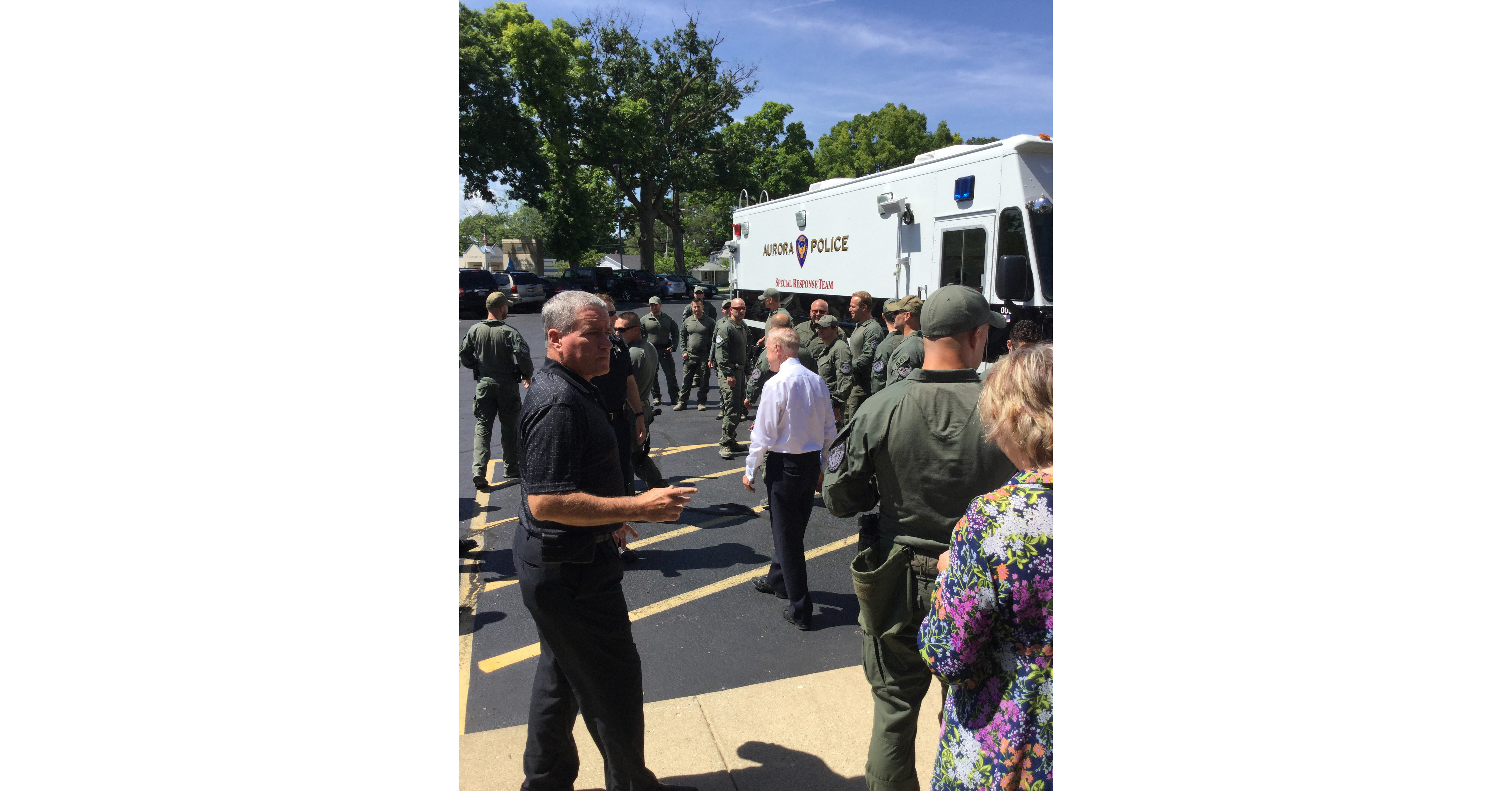 Aurora Police Chief thanks Alarm Detection Systems for donation of ...
