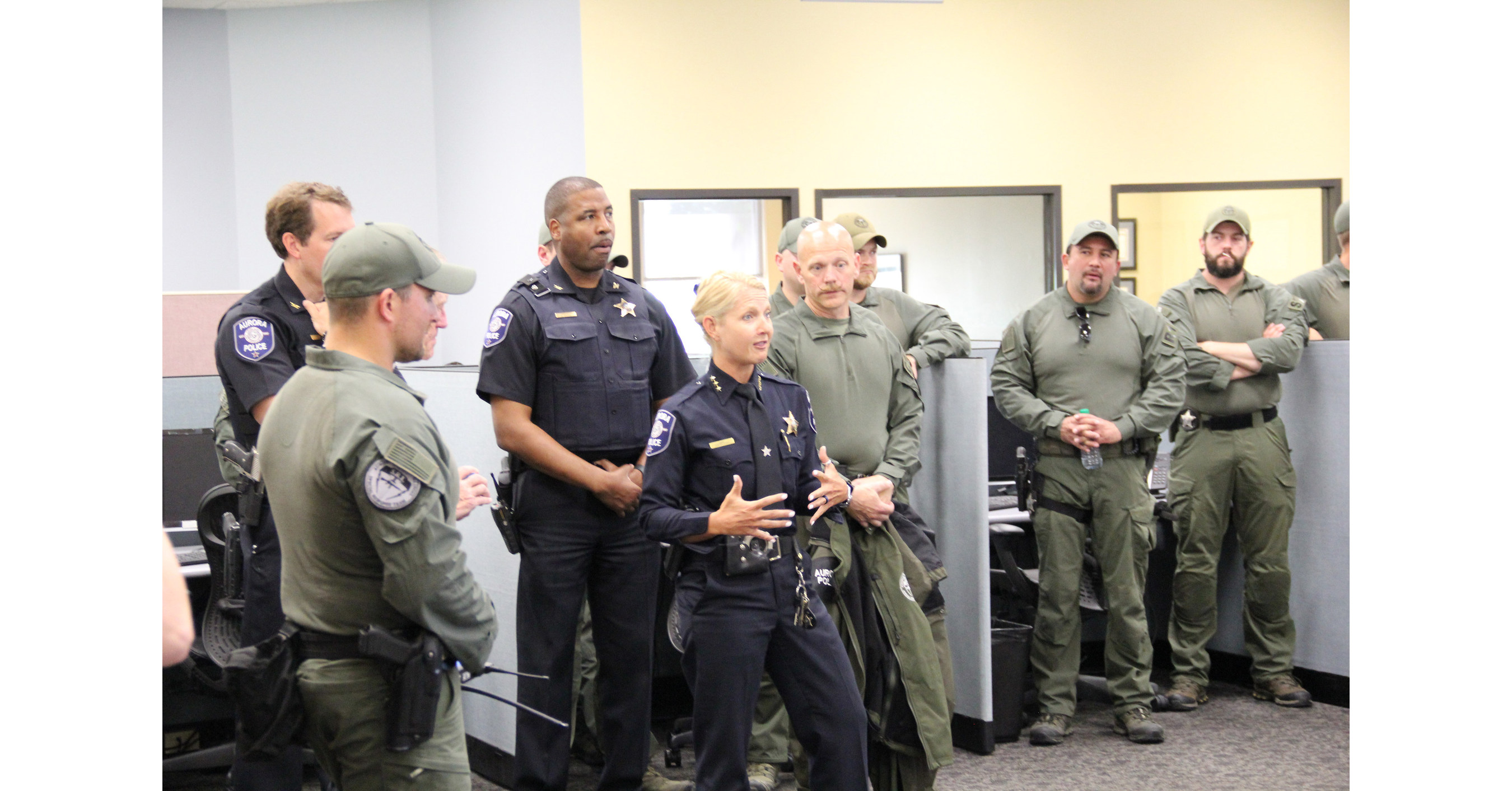 Aurora Police Chief thanks Alarm Detection Systems for donation of ...
